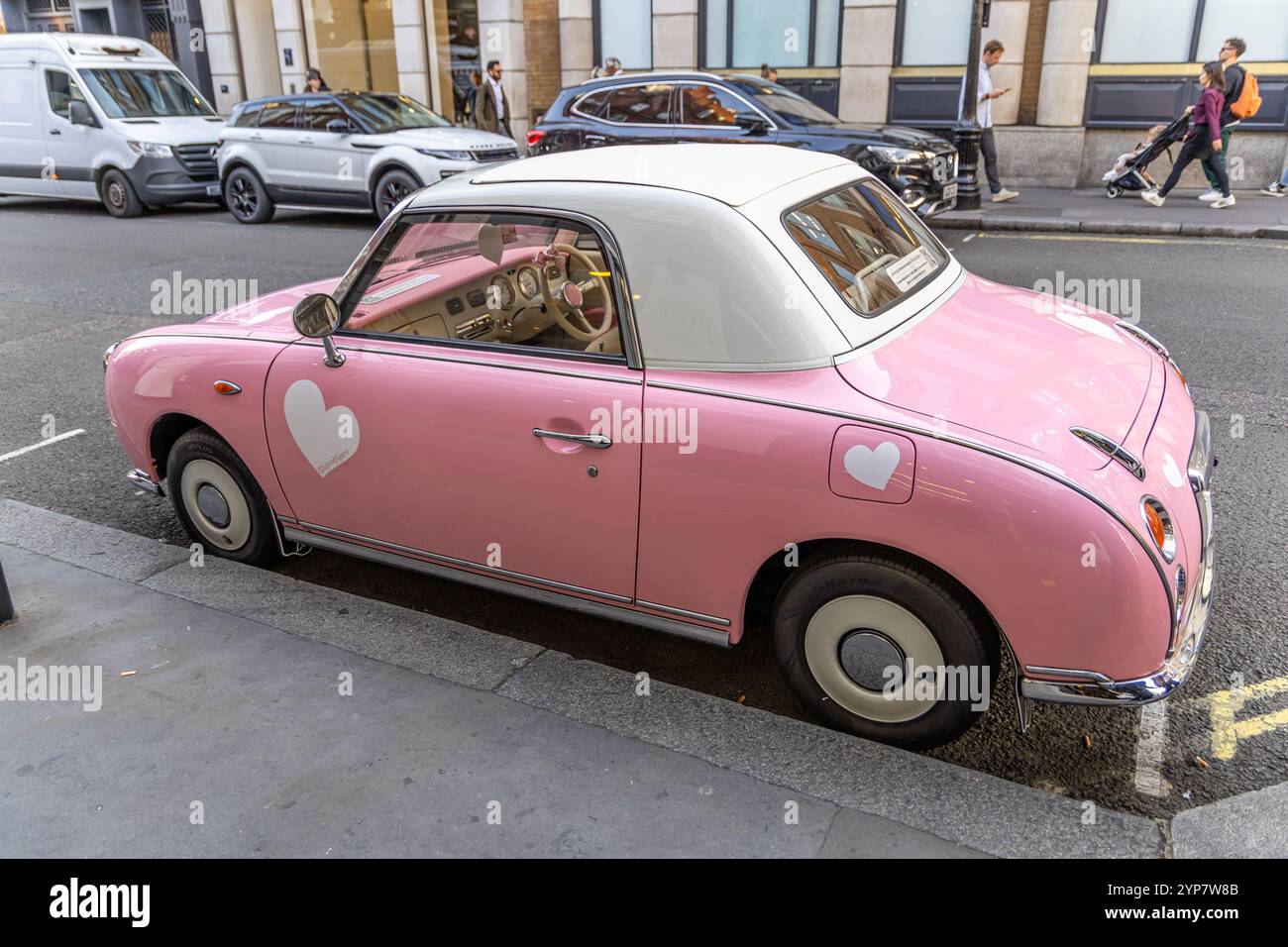 London, UK- September 19, 2024: Nissan Figaro pink retro car parked in ...