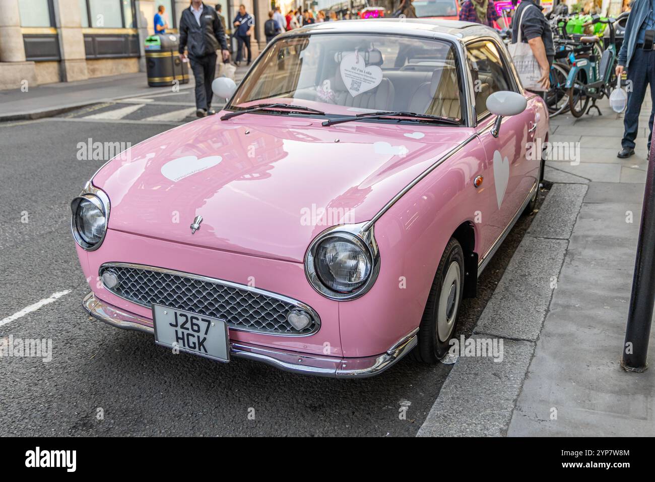 London, UK- September 19, 2024: Nissan Figaro pink retro car parked in ...