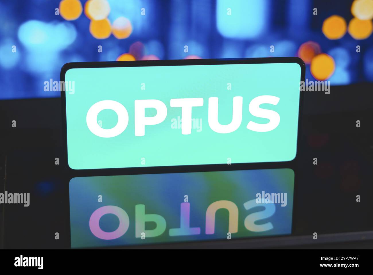 In this photo illustration, the Optus logo is displayed on a smartphone ...