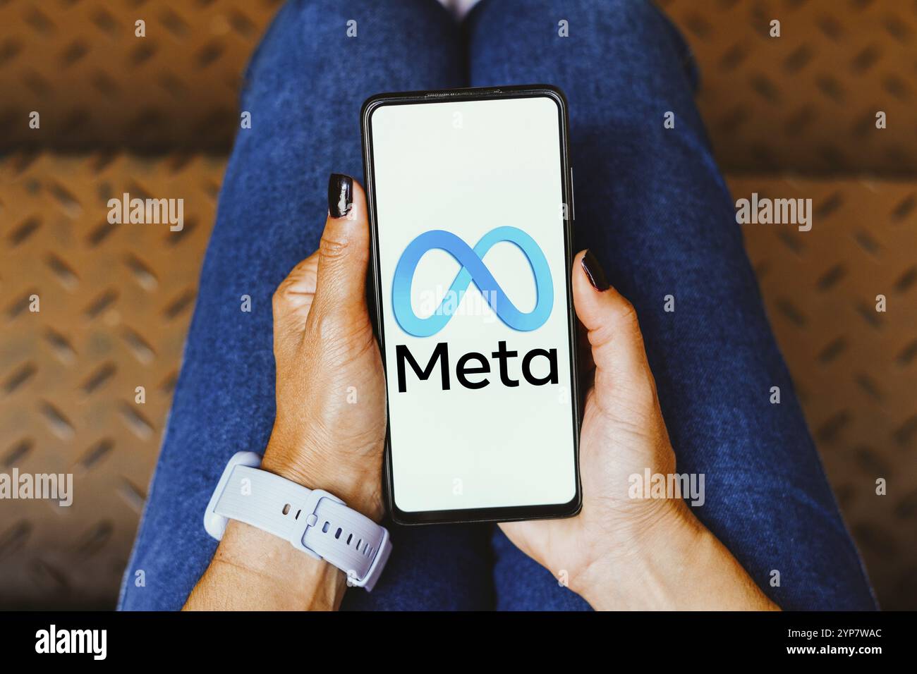 In this photo illustration, the Meta Platforms logo is displayed on a ...