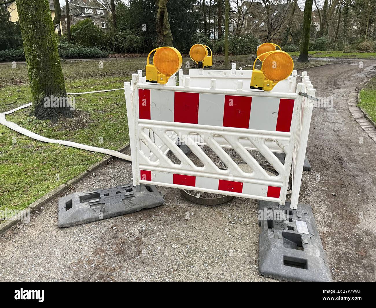 Red and white barrier on a footpath Stock Photo - Alamy