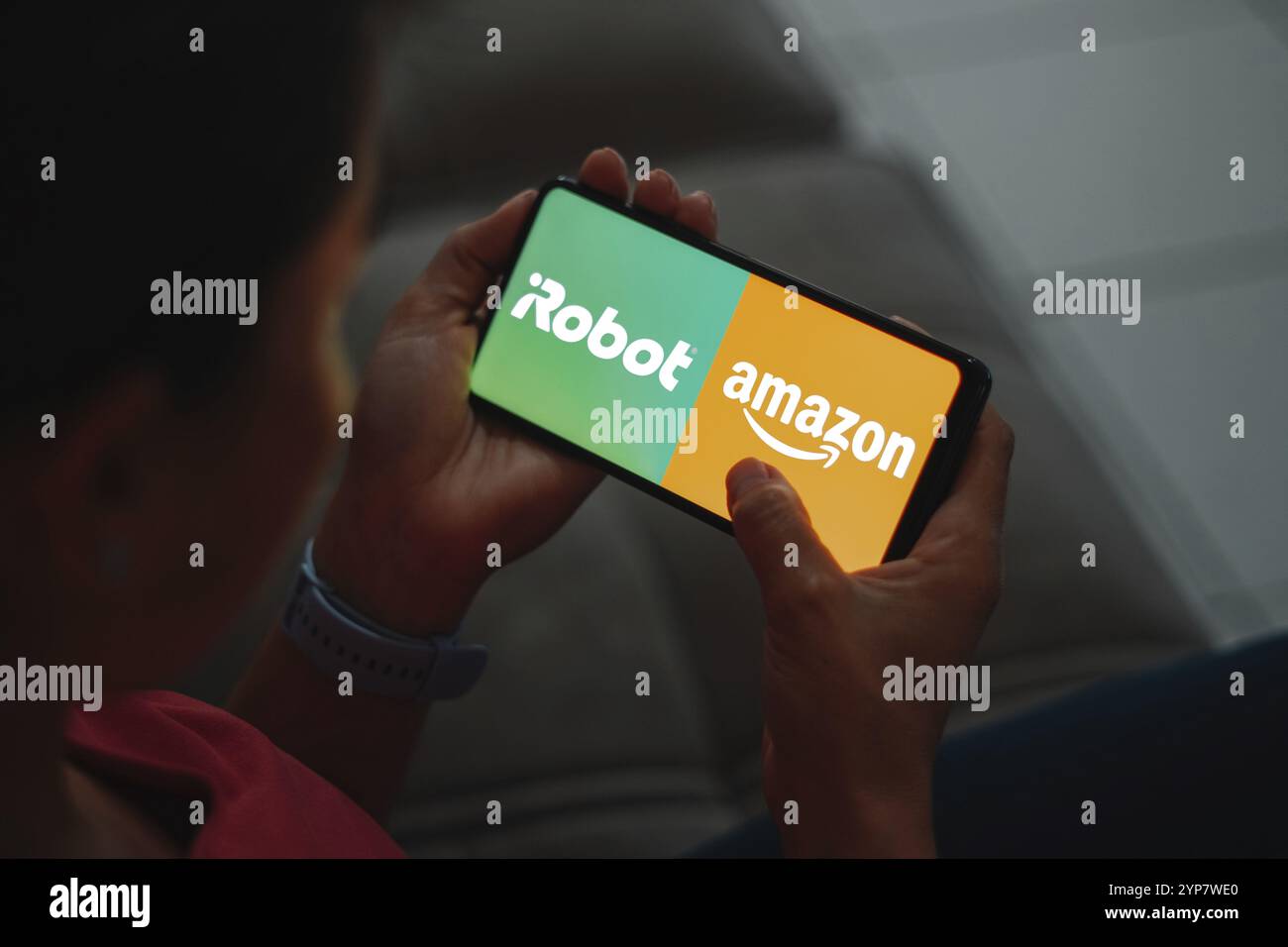In this photo illustration, the IRobot and Amazon logo is displayed on ...