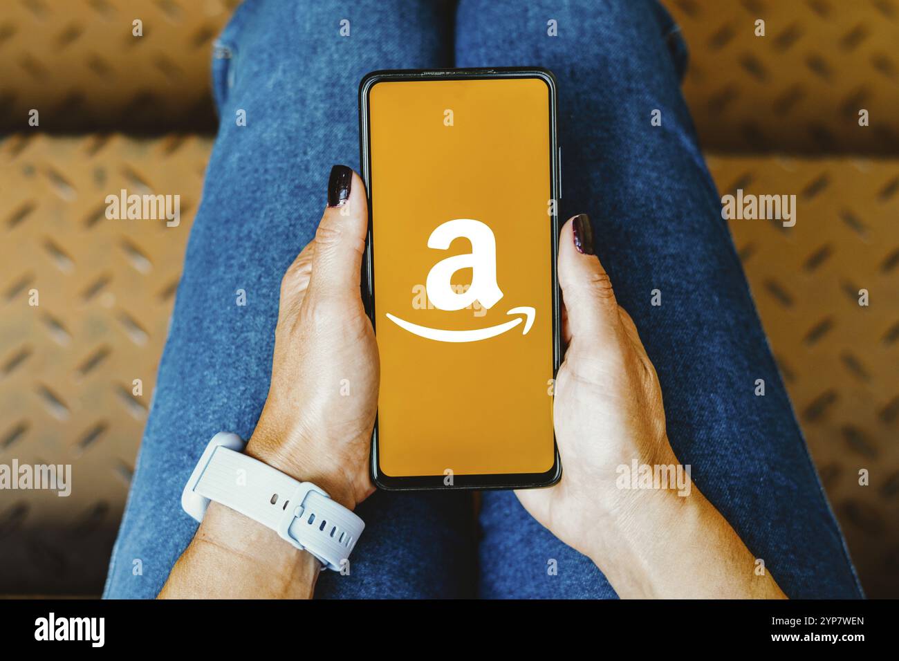 In this photo illustration, the Amazon logo is displayed on a ...