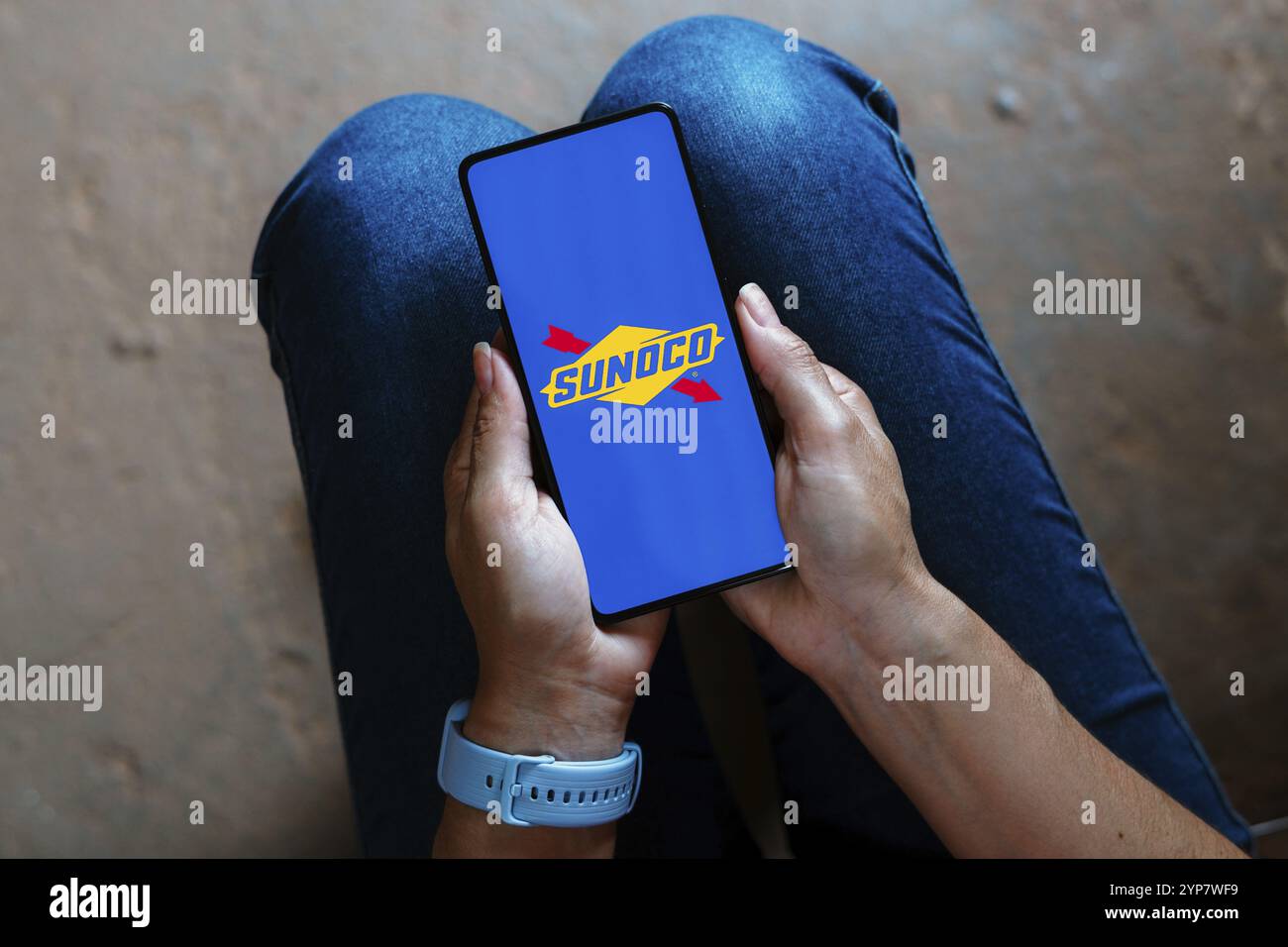 In this photo illustration, the Sunoco logo is displayed on a ...