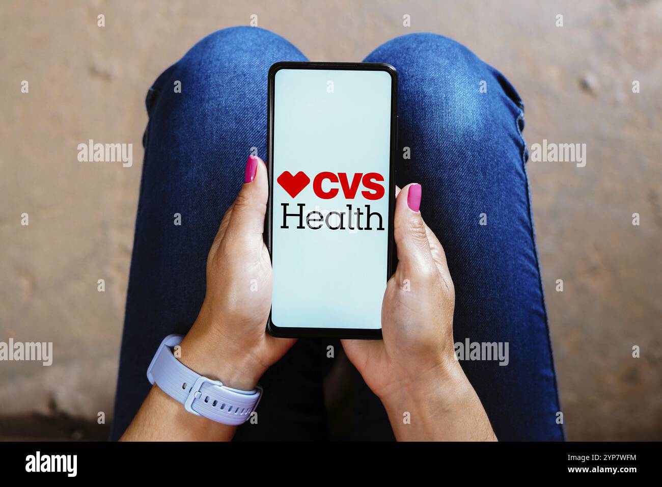 In this photo illustration, the CVS Health logo seen displayed on a ...