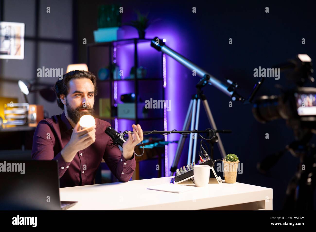 Tech guru teaching viewers how to fix defective smart light bulb ...