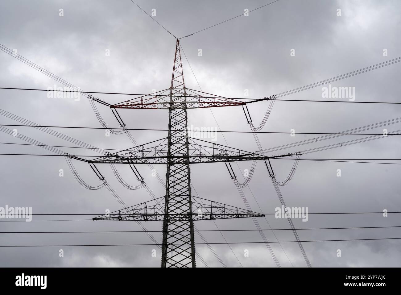 Large electricity pylons in detail under stormy skies Stock Photo - Alamy