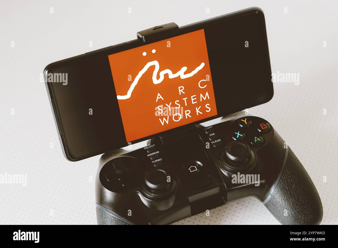 In this photo illustration, the Arc System Works logo displayed on a ...