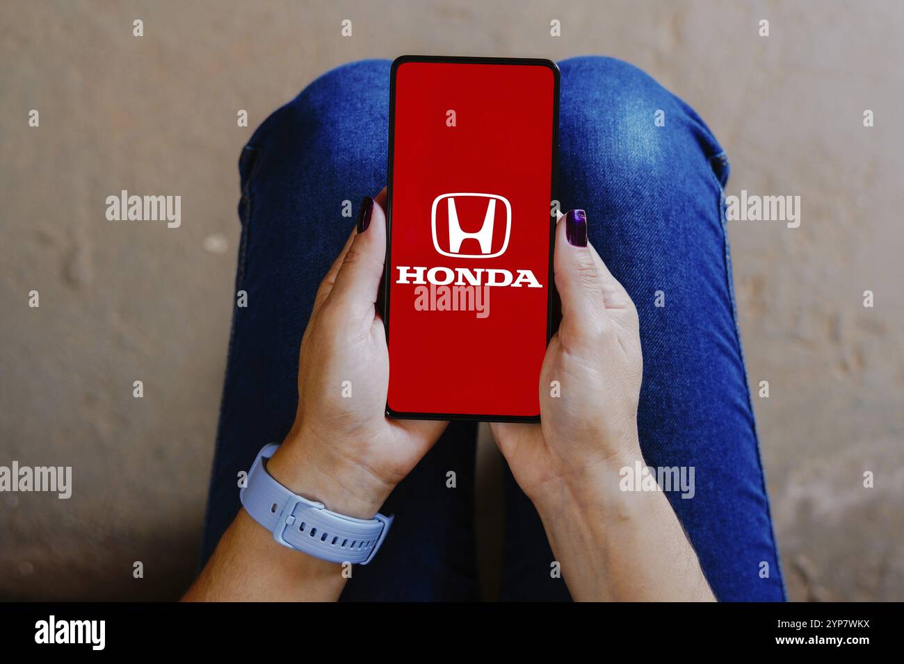 In this photo illustration, the Honda logo is displayed on a smartphone ...