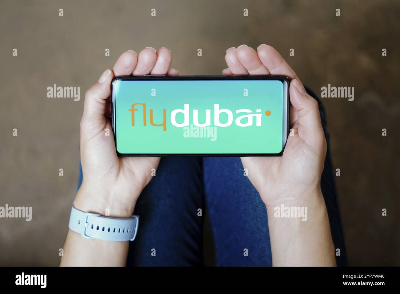 In this photo illustration, the FlyDubai logo seen displayed on a ...