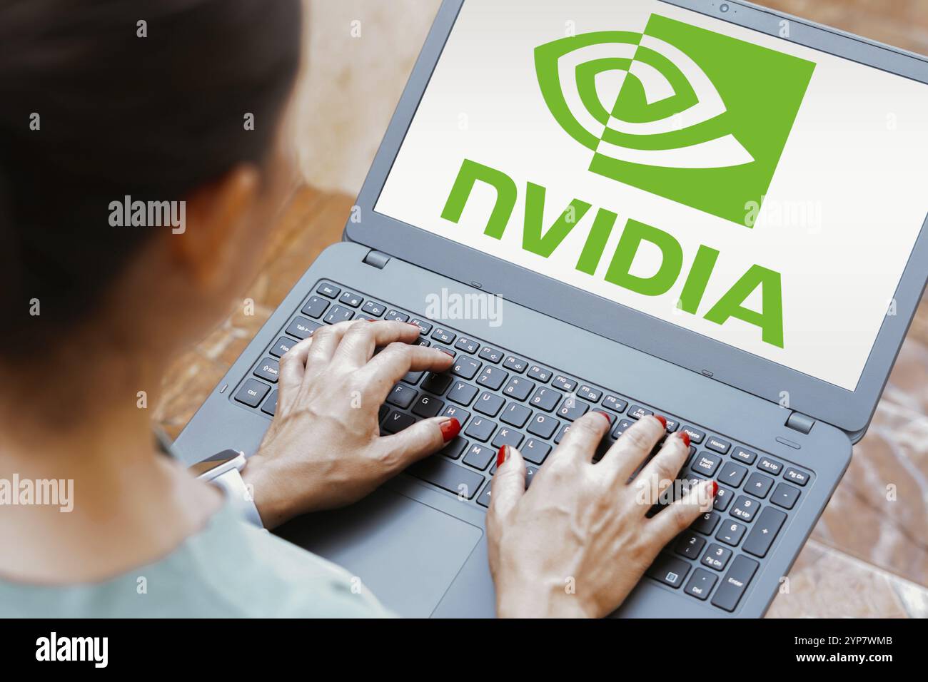 In this photo illustration, the Nvidia logo is displayed on a laptop ...