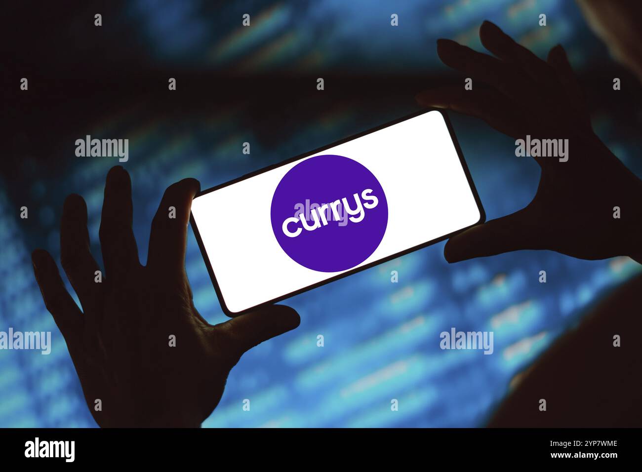 In this photo illustration, the Currys logo is displayed on a ...