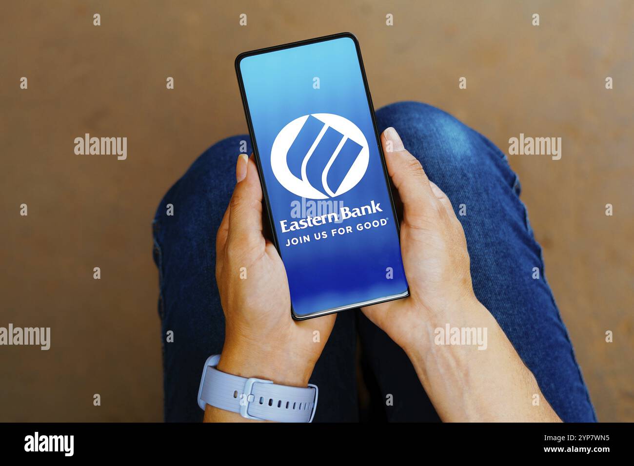 In this photo illustration, the Eastern Bank logo is displayed on a ...