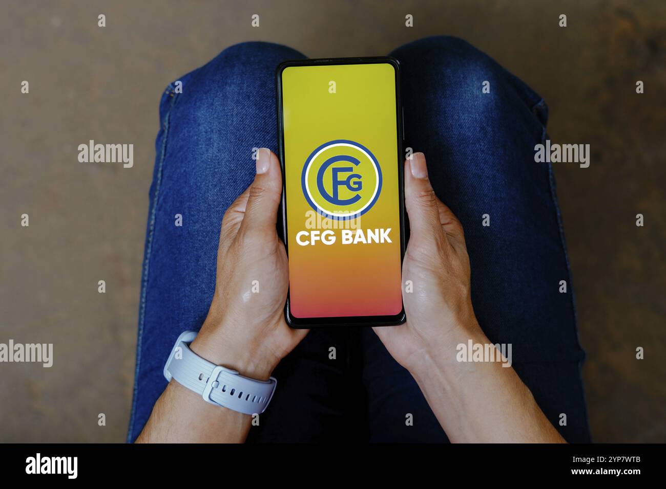 In this photo illustration, the CFG Bank logo is displayed on a ...