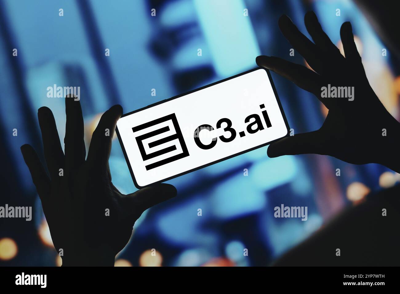 In this photo illustration, the C3 AI logo is displayed on a smartphone ...