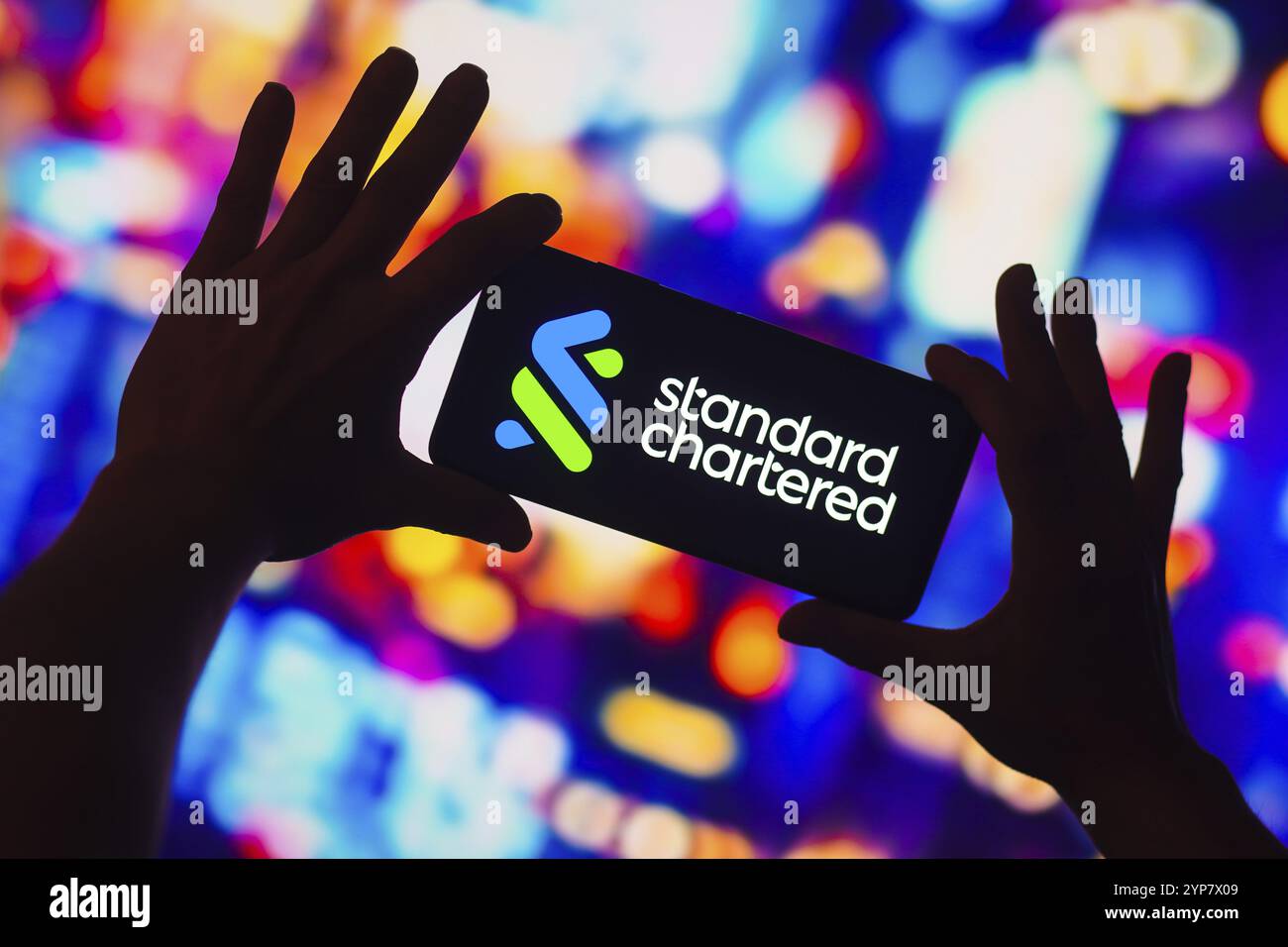 In this photo illustration, the Standard Chartered Bank logo is ...