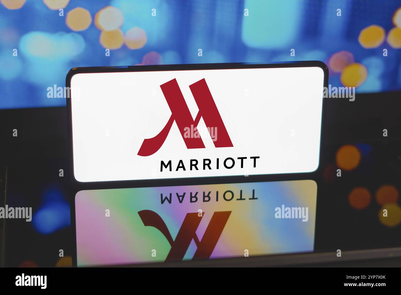 In this photo illustration, the Marriott logo is displayed on a ...