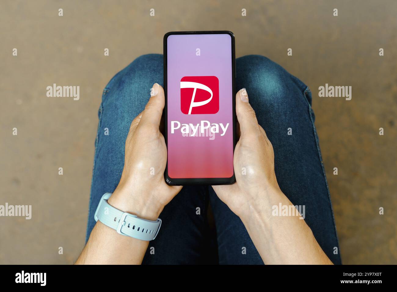 In this photo illustration, the PayPay Corporation logo is displayed on a smartphone screen ...