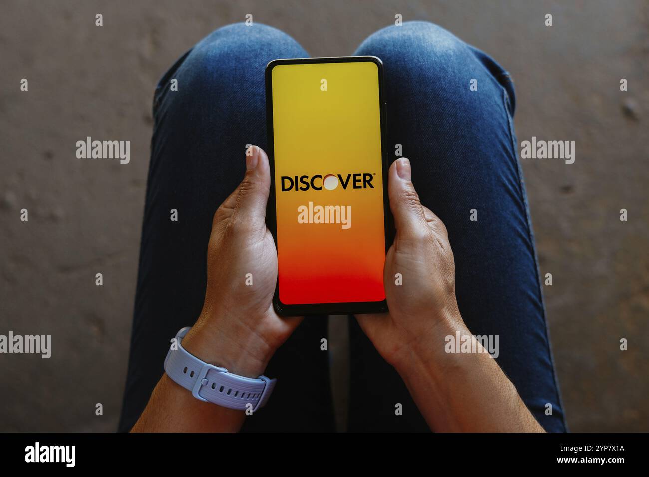In this photo illustration, the Discover logo is displayed on a ...