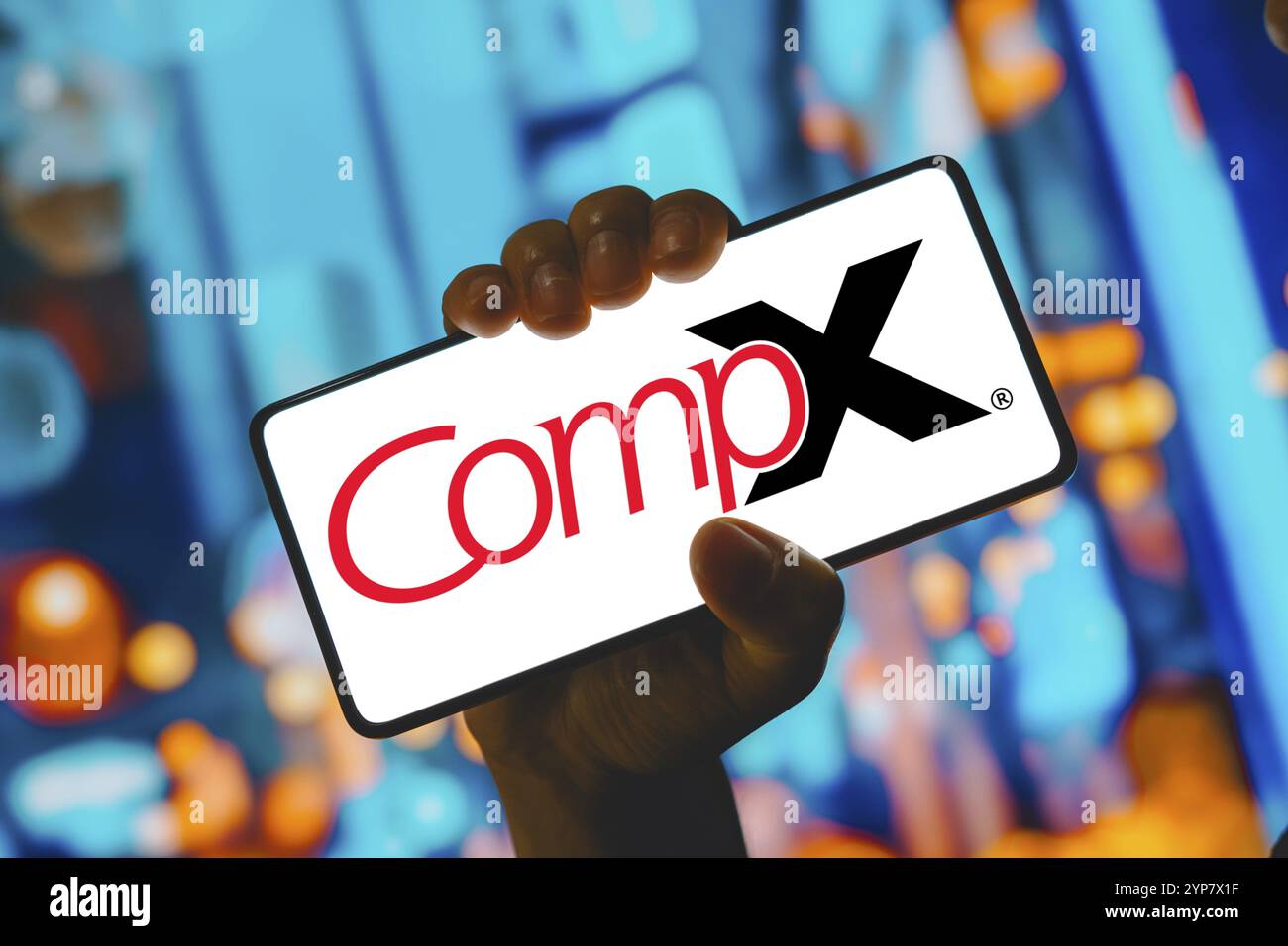 In this photo illustration, the CompX International logo is displayed ...