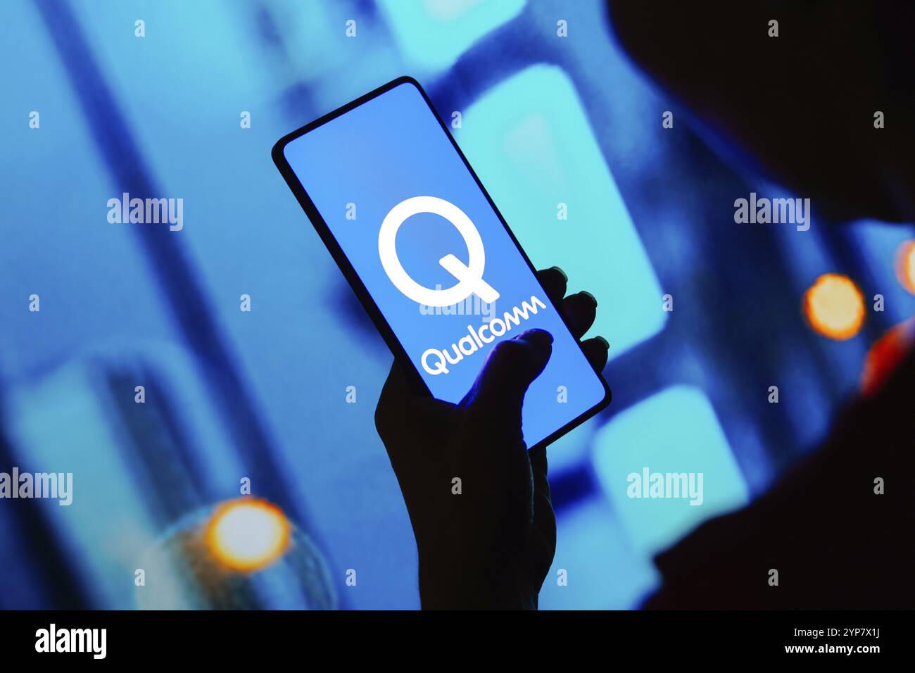 In this photo illustration, the Qualcomm logo is displayed on a ...