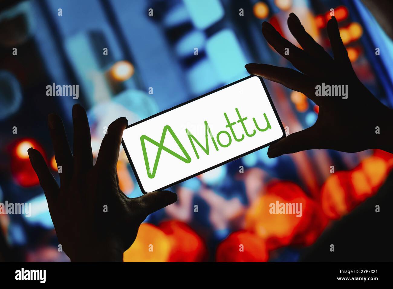 In this photo illustration, the Mottu logo is displayed on a smartphone ...