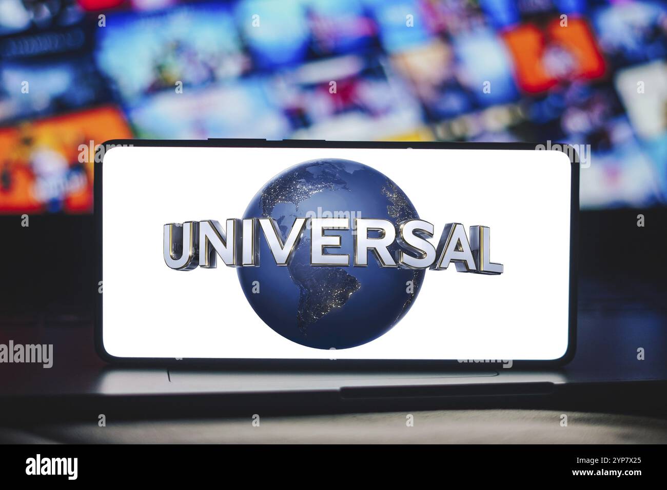 In this photo illustration, the Universal Studios logo is displayed on ...