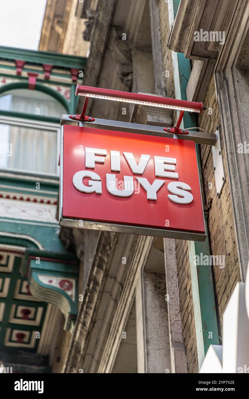 London, UK- September 19, 2024: Five Guys restaurant exterior, red sign ...