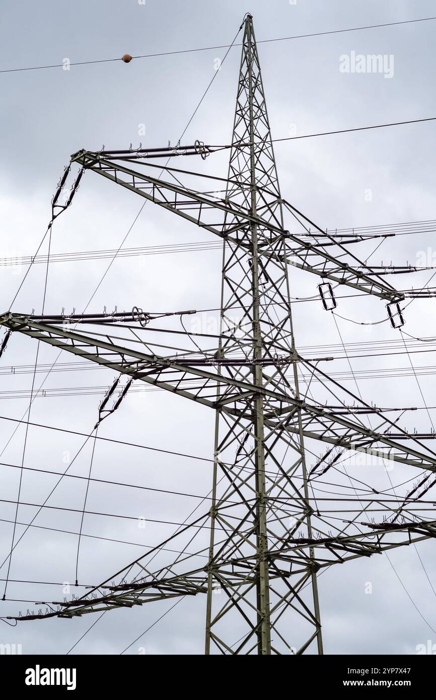 Large electricity pylons in detail under stormy skies Stock Photo - Alamy