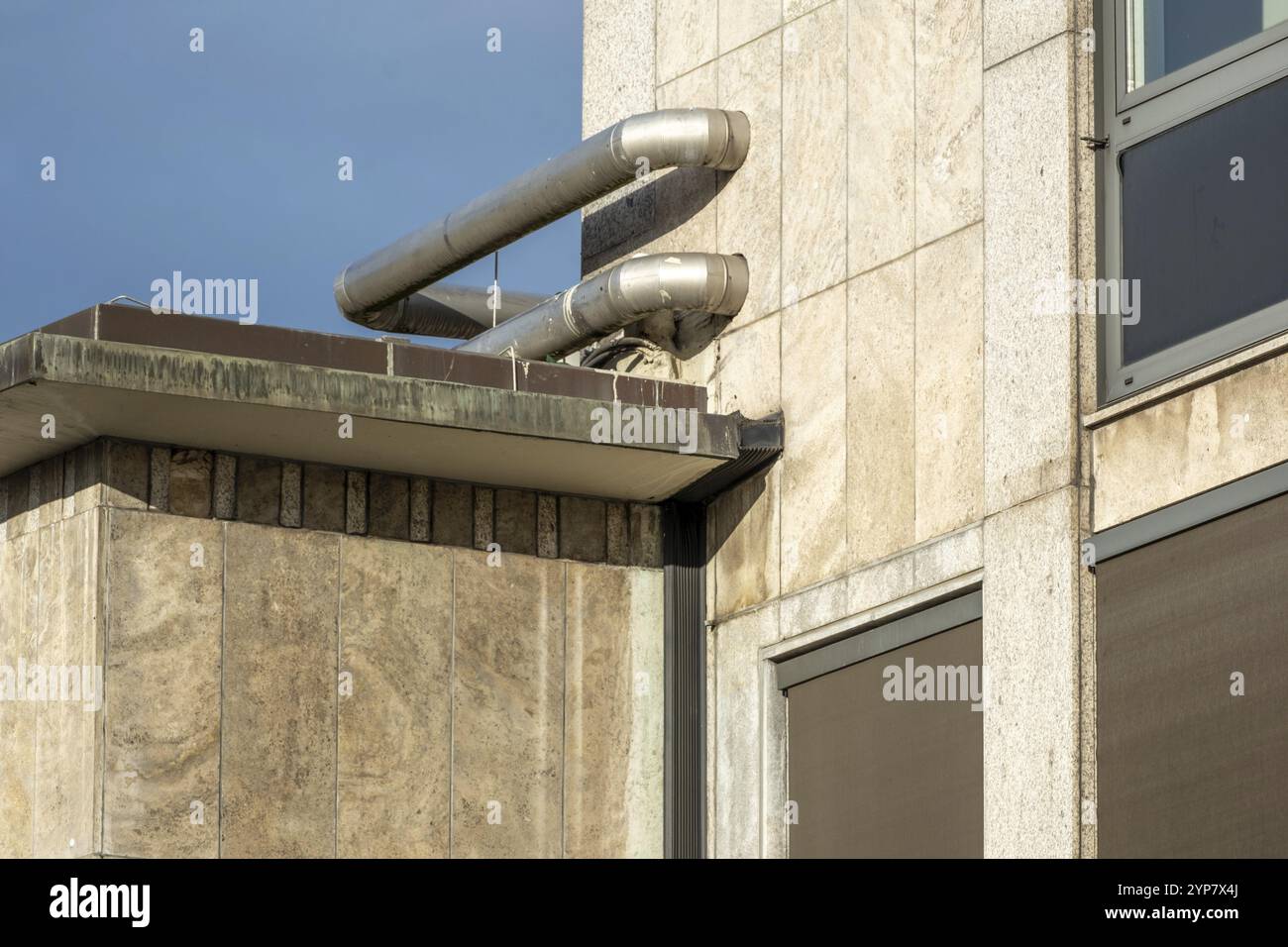 Piping on exterior wall of office building Stock Photo - Alamy