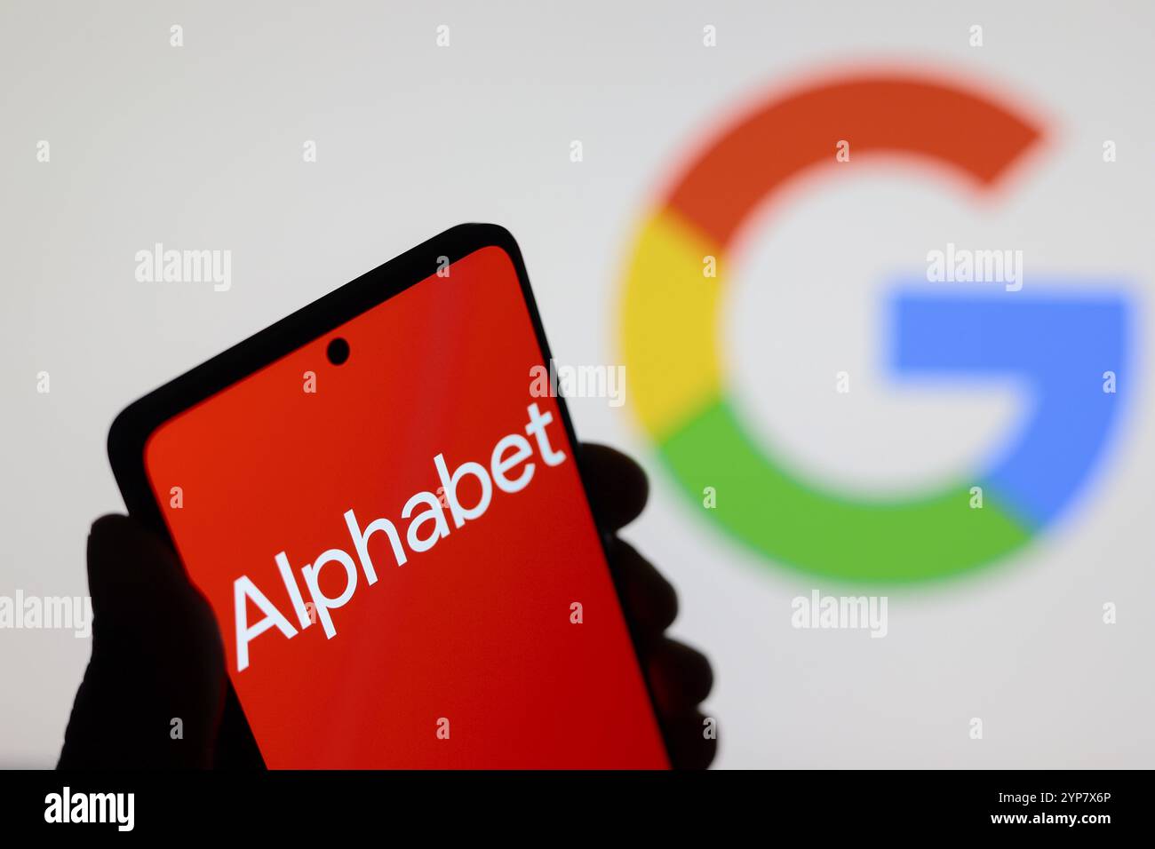 logo seen displayed on a smartphone screen and the Google logo in the ...