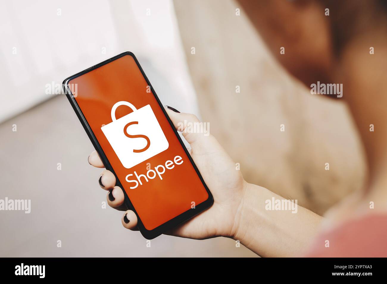 In this photo illustration, the Shopee logo is displayed on a ...