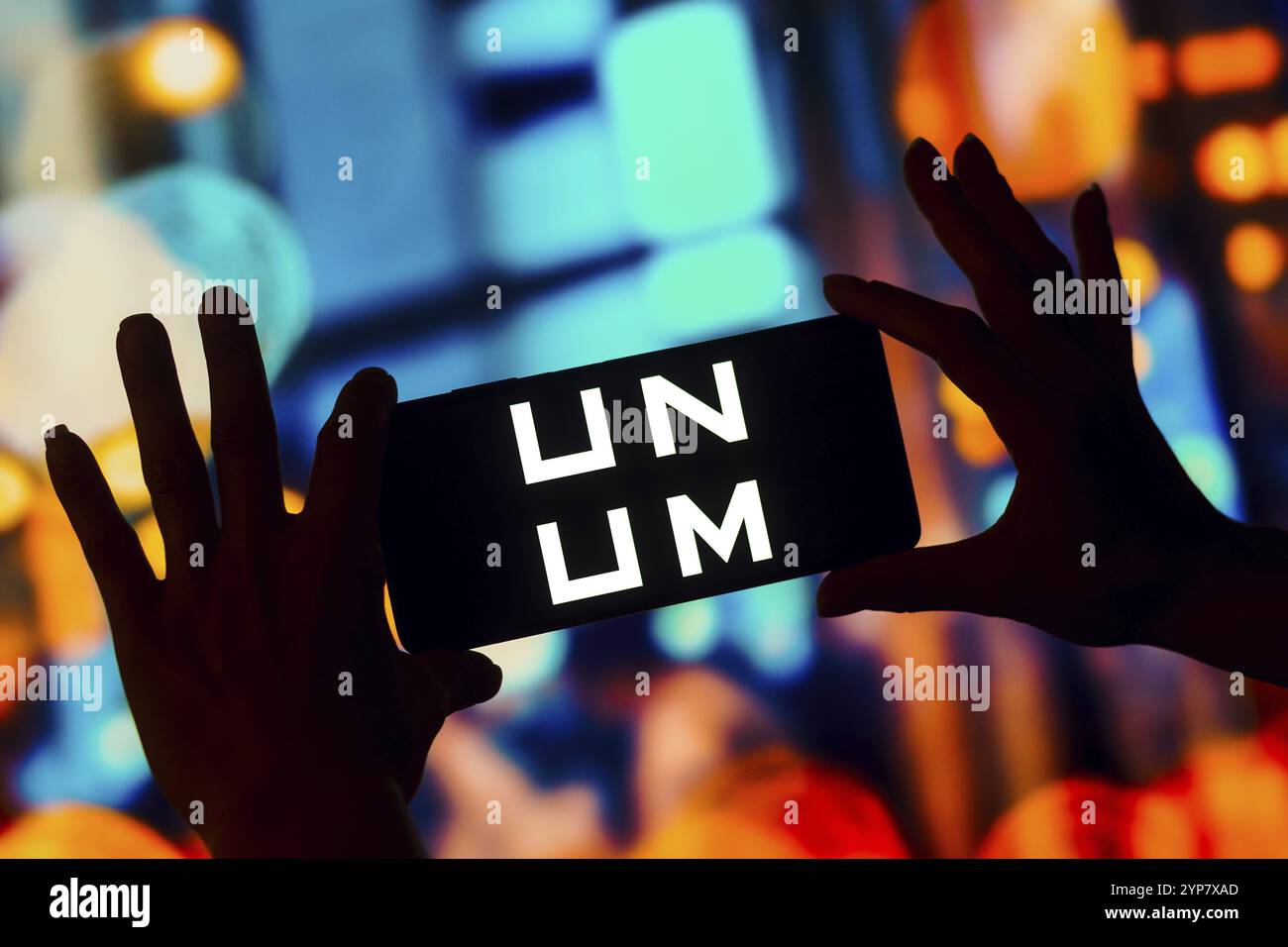 In this photo illustration, the Unum Group logo is displayed on a ...