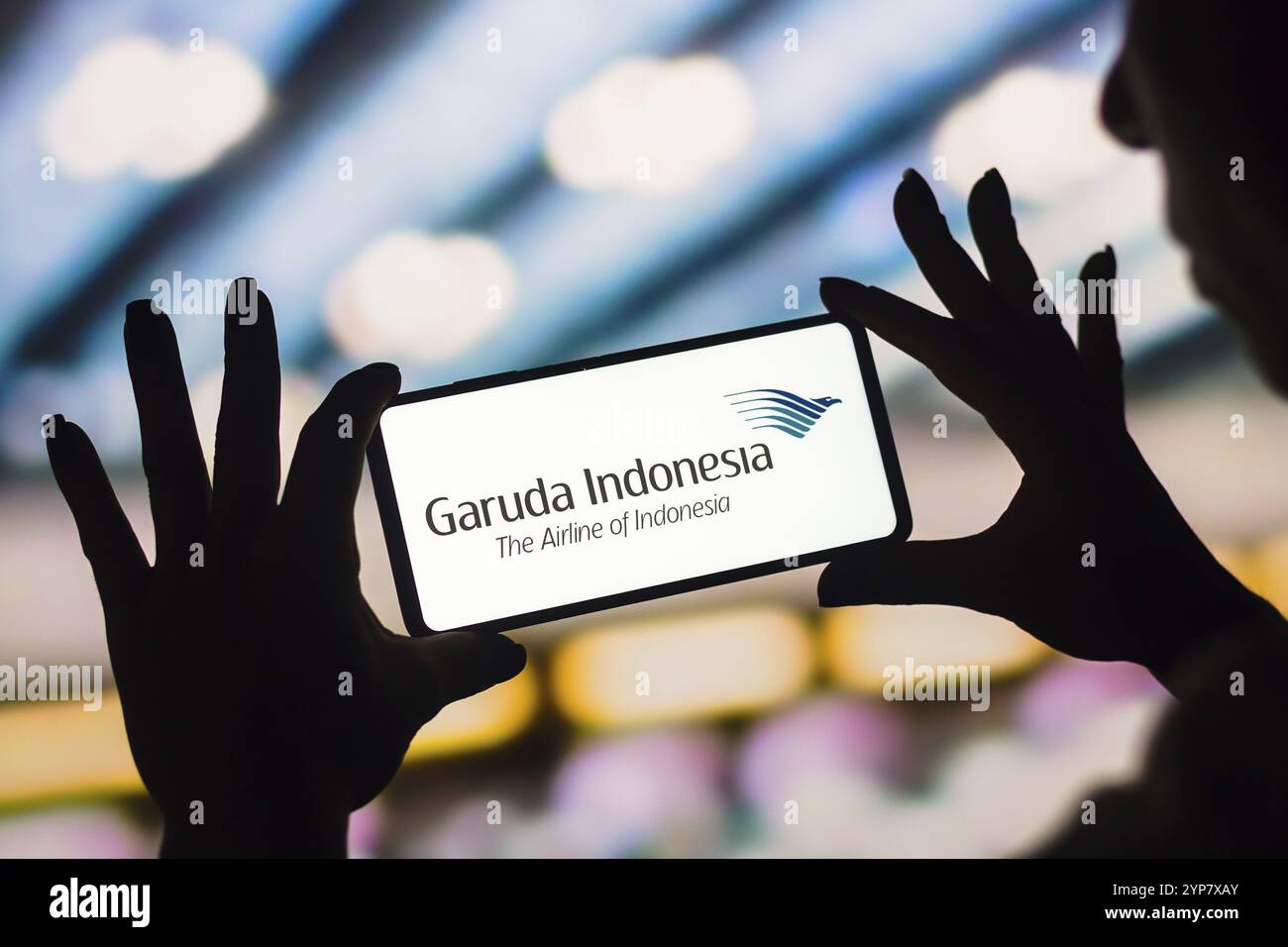 In this photo illustration, the Garuda Indonesia logo is displayed on a ...