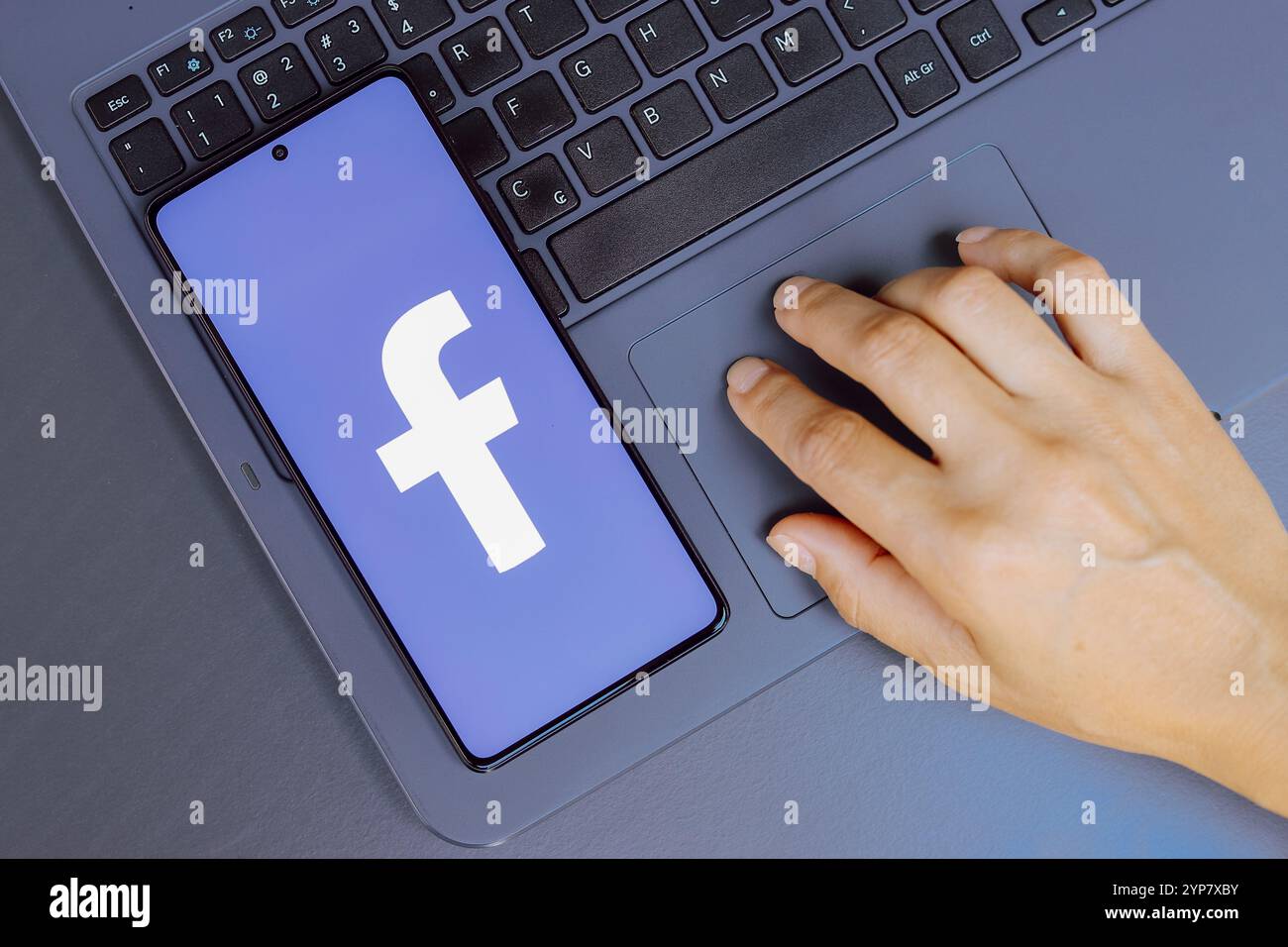 In this photo illustration, the Facebook logo is displayed on a ...