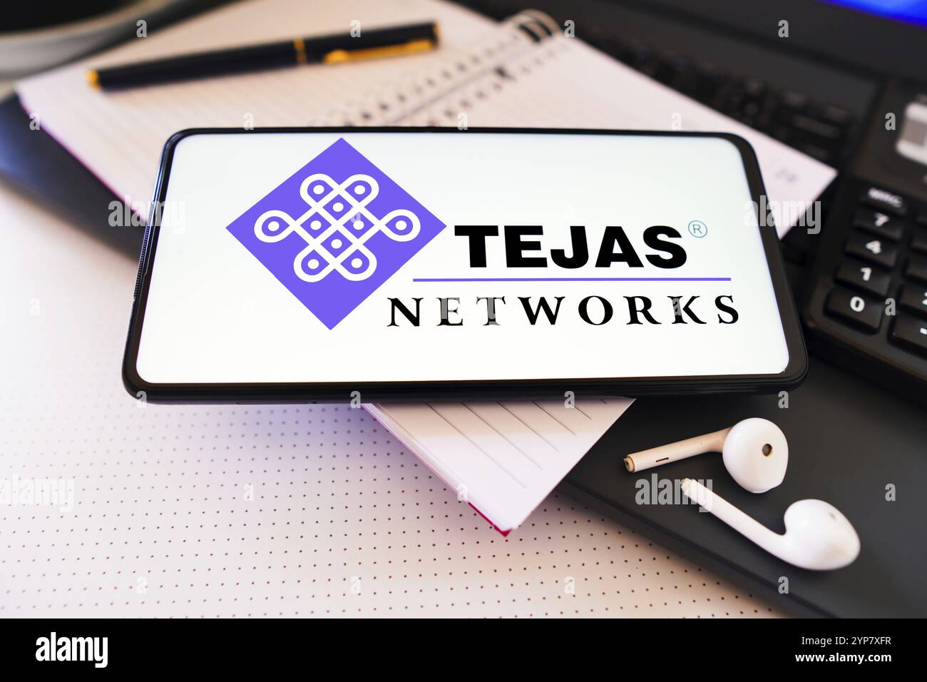 In this photo illustration, the Tejas Networks logo is displayed on a ...