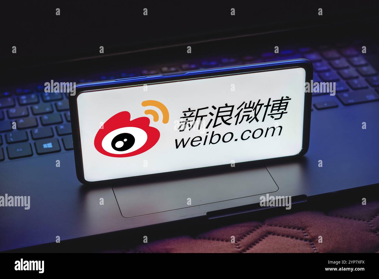 In this photo illustration, the Sina Weibo logo is displayed on a smartphone screen Stock Photo ...