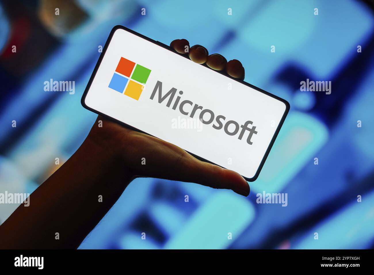 In this photo illustration, the Microsoft logo is displayed on a ...