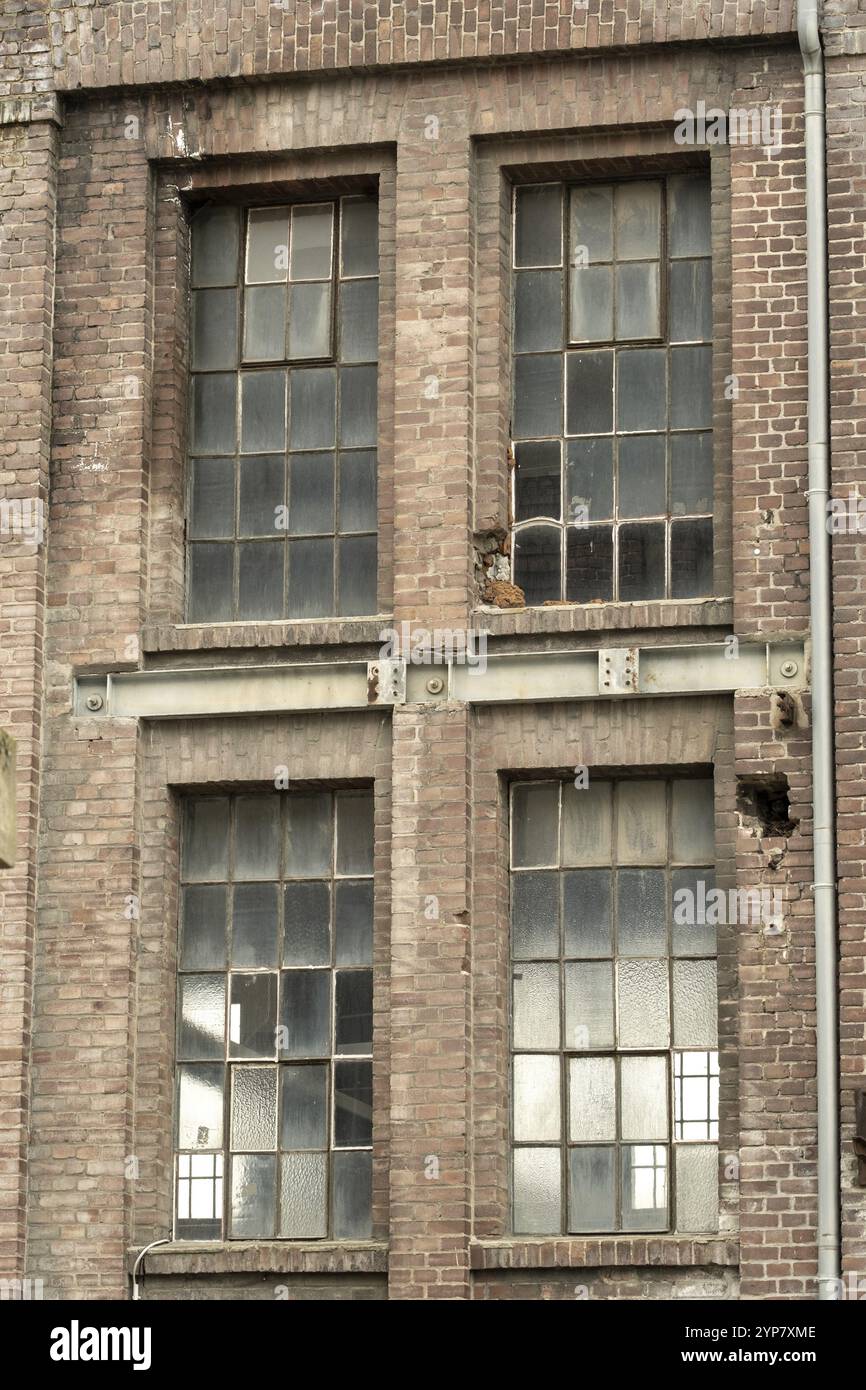 Details of an old industrial building, brick wall and windows, approx ...