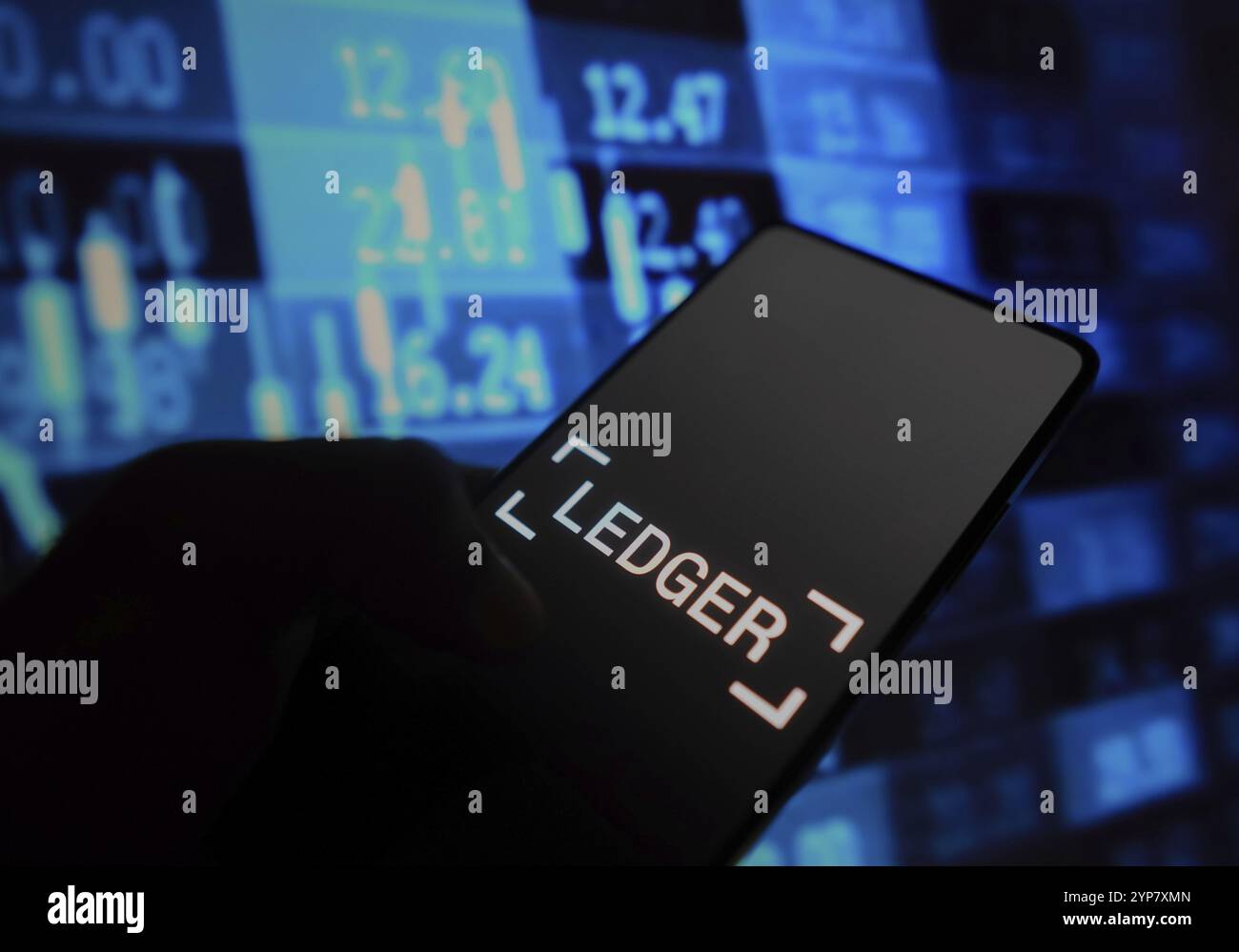 In this photo illustration, the Ledger logo is displayed on a ...