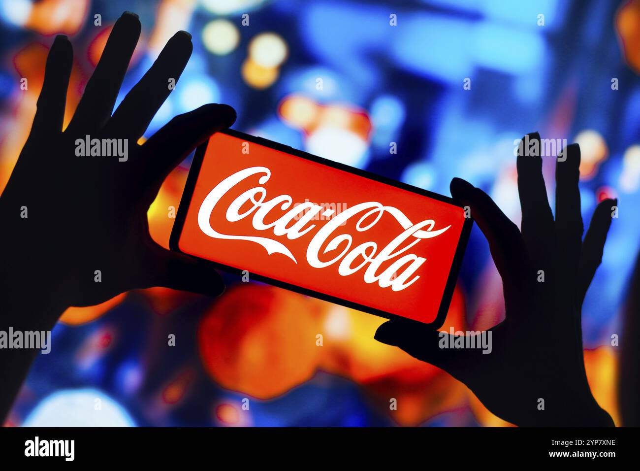 In this photo illustration, the Coca-Cola logo is displayed on a ...
