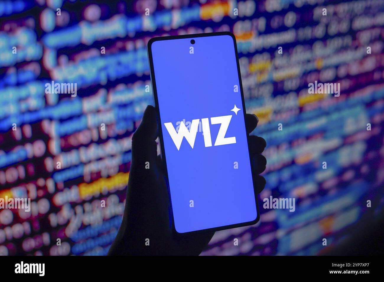In this photo illustration, the Wiz logo is displayed on a smartphone ...