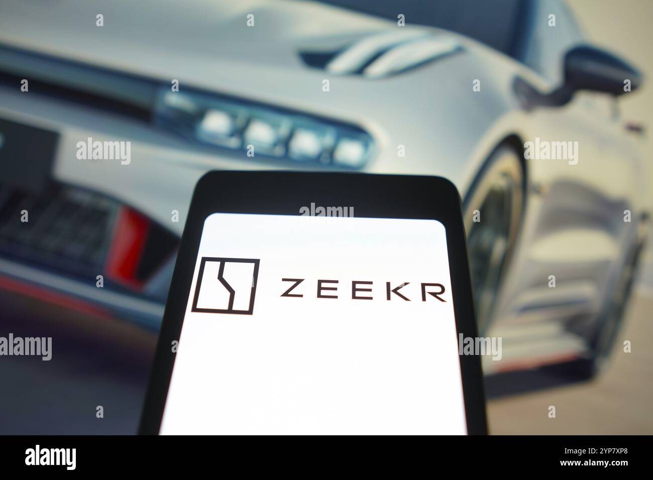 In this photo illustration, the Zeekr logo is displayed on a smartphone ...