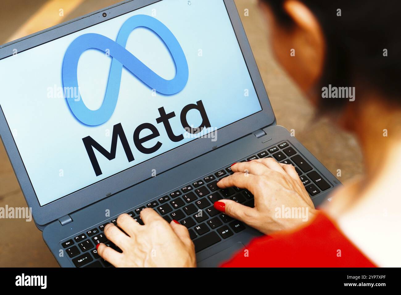 In this photo illustration, the Meta logo is displayed on a notebook ...