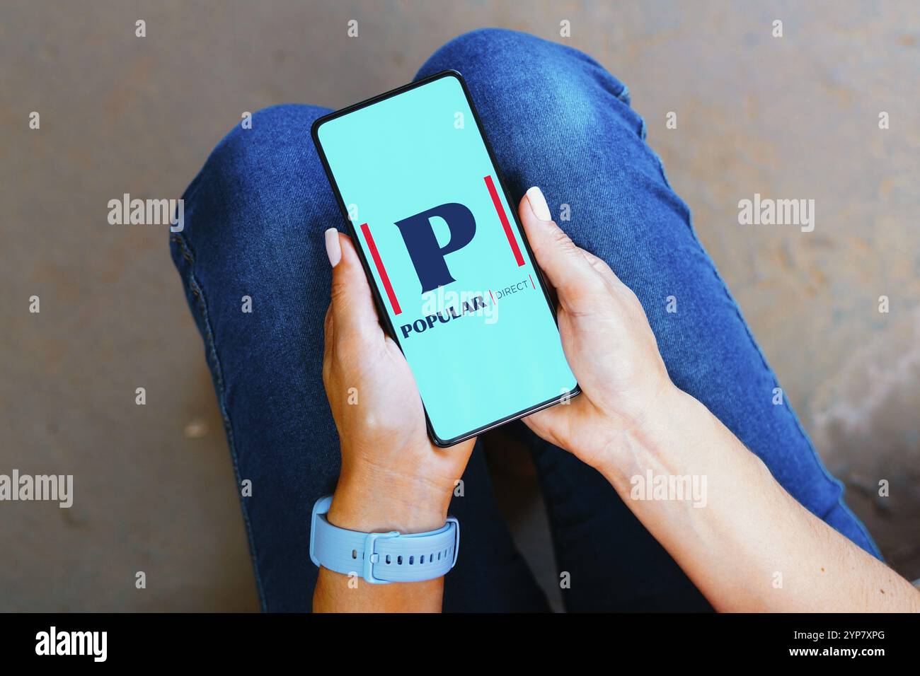 In this photo illustration, the Popular Direct logo is displayed on a ...