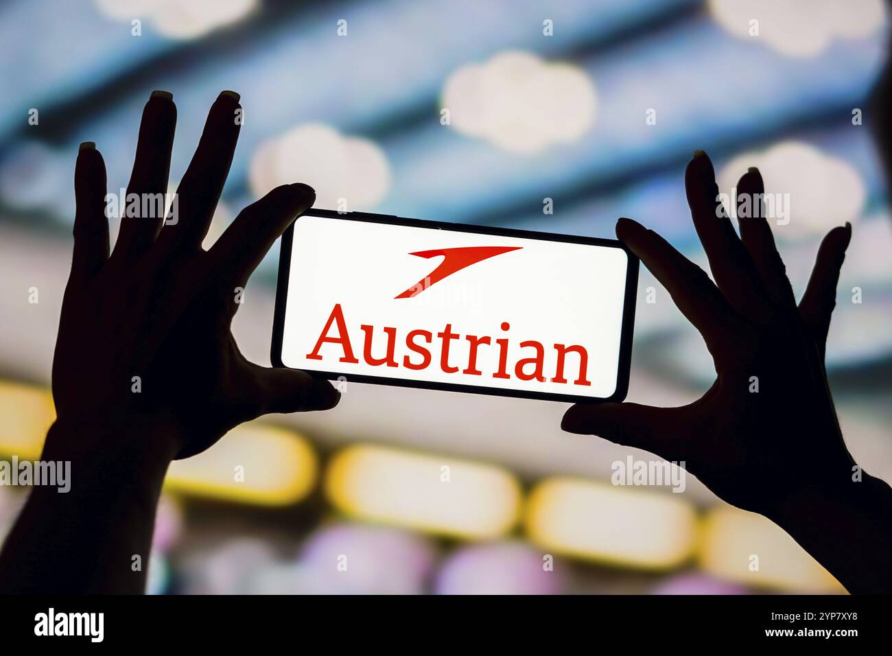 In this photo illustration, the Austrian Airlines logo is displayed on ...