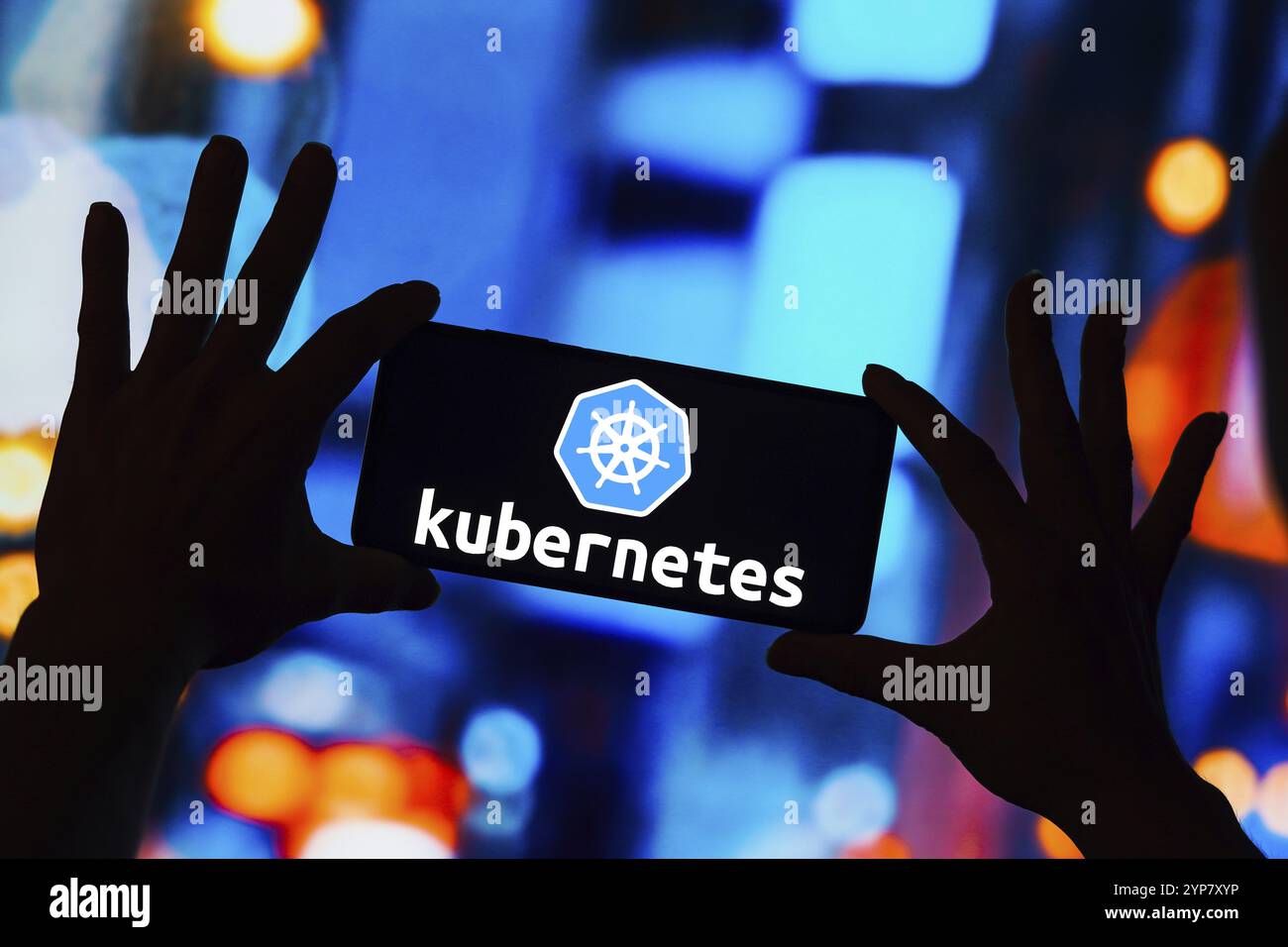 In this photo illustration, the Kubernetes logo seen displayed on a ...