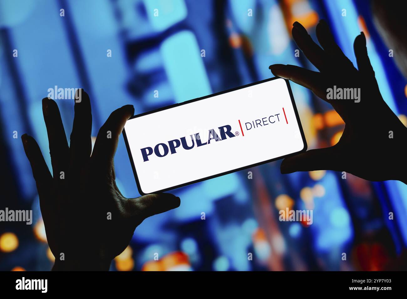 In this photo illustration, the Popular Direct logo is displayed on a ...