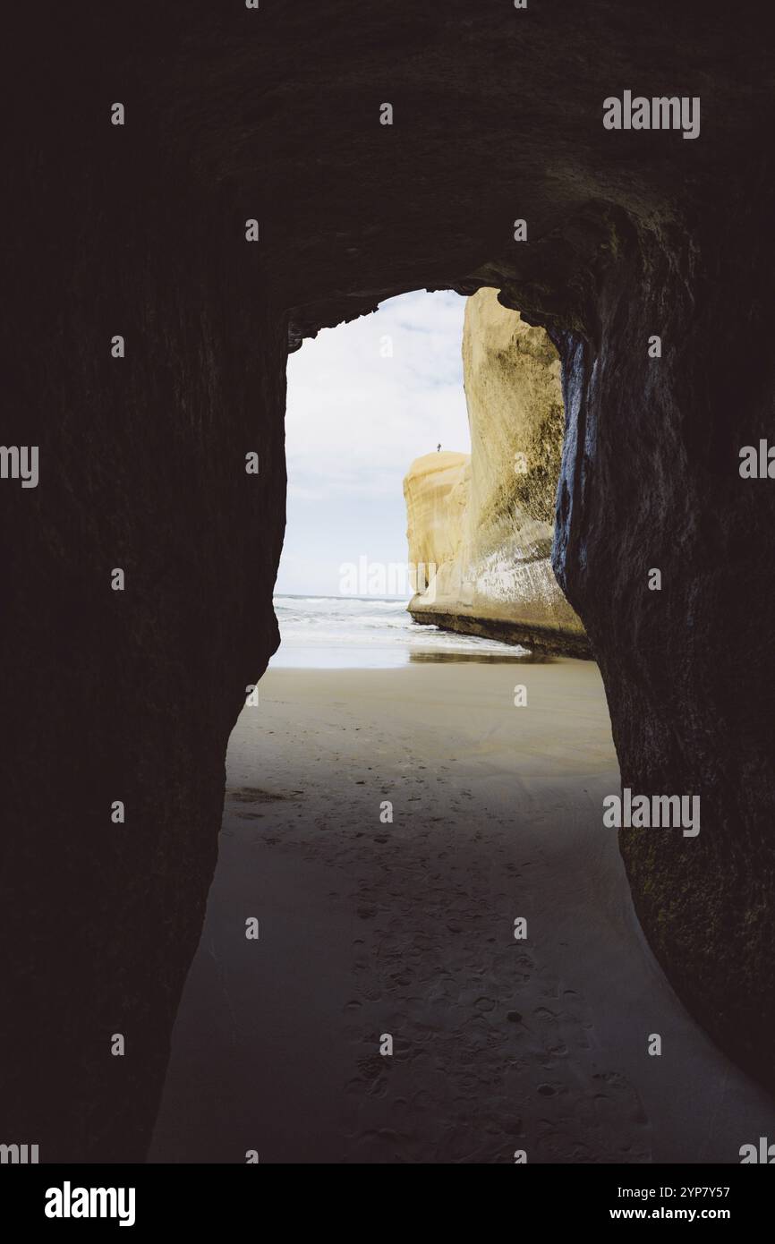 View of the sea through the dark entrance of a cave, Dunedin, New ...