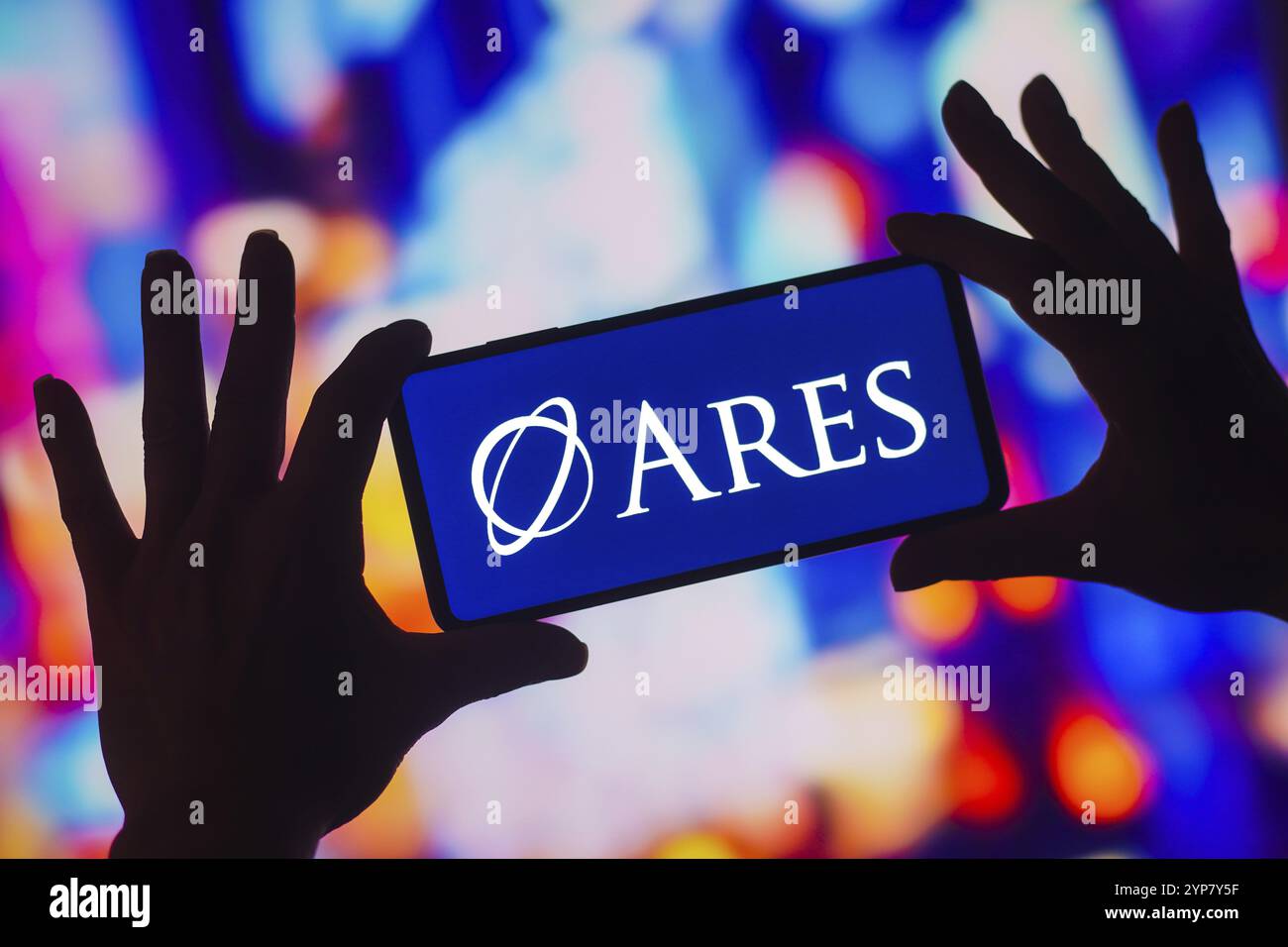 In this photo illustration, the Ares Management Corporation logo is displayed on a smartphone ...